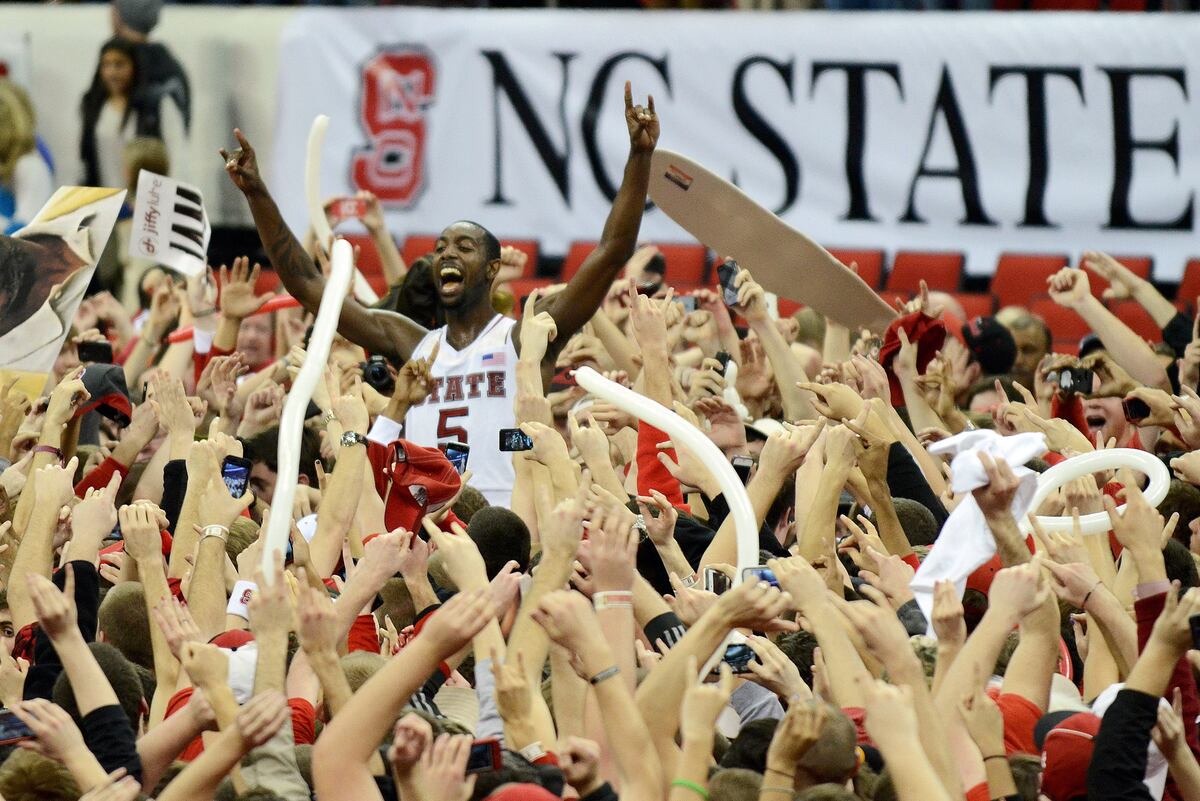 NC State Fan in Wheelchair Rushes Court and Gets Assist from CJ Leslie ...