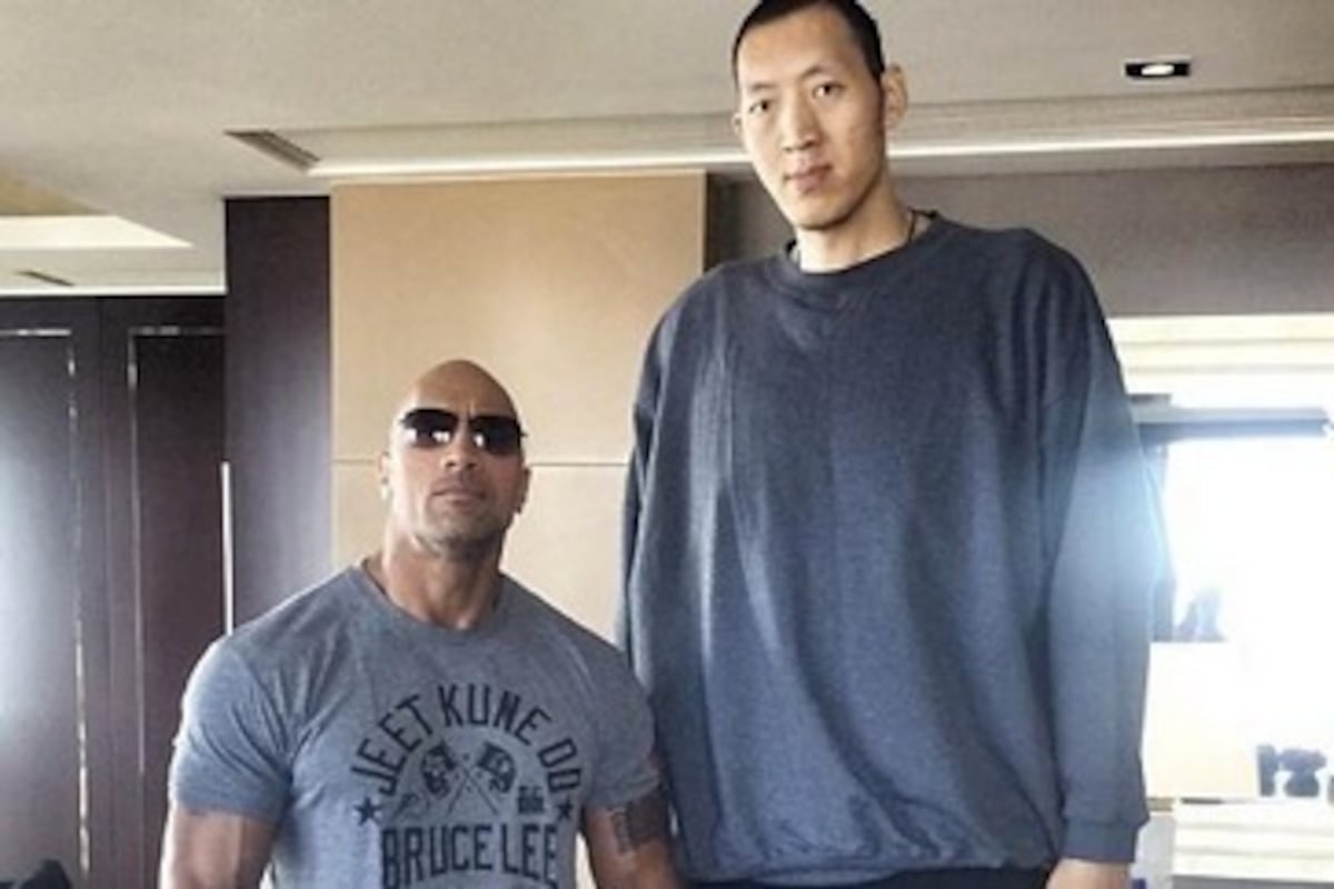The Rock Takes a Photo with 7'9" Basketball Player Sun Ming Ming ...