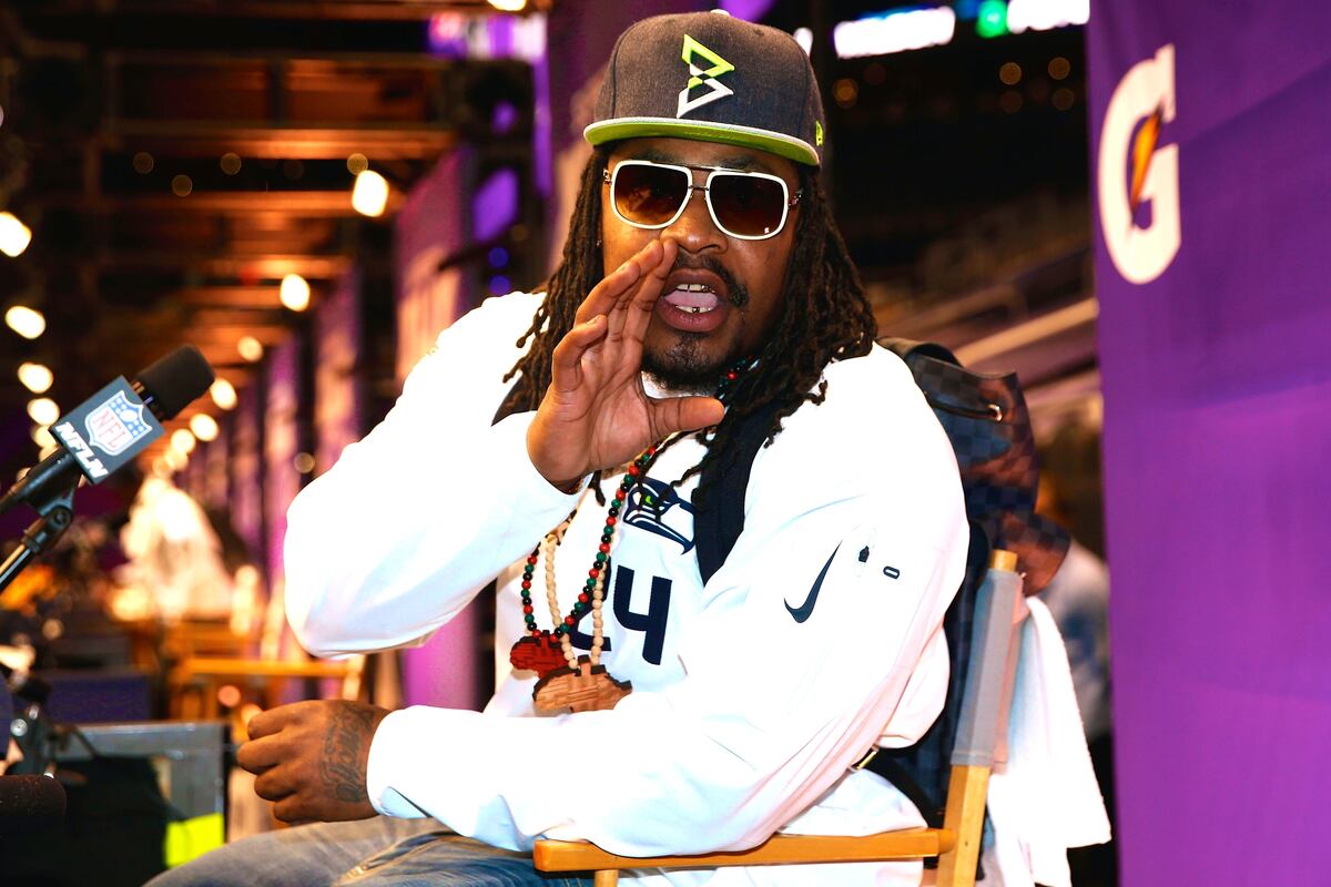 Marshawn Lynch Not Fined for 'Beast Mode' Hat, Super Bowl Media Day ...