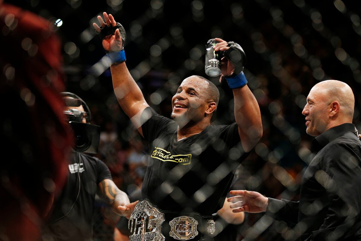 Photo: Newly Minted UFC LHW Champ Daniel Cormier Shows off His Belts ...
