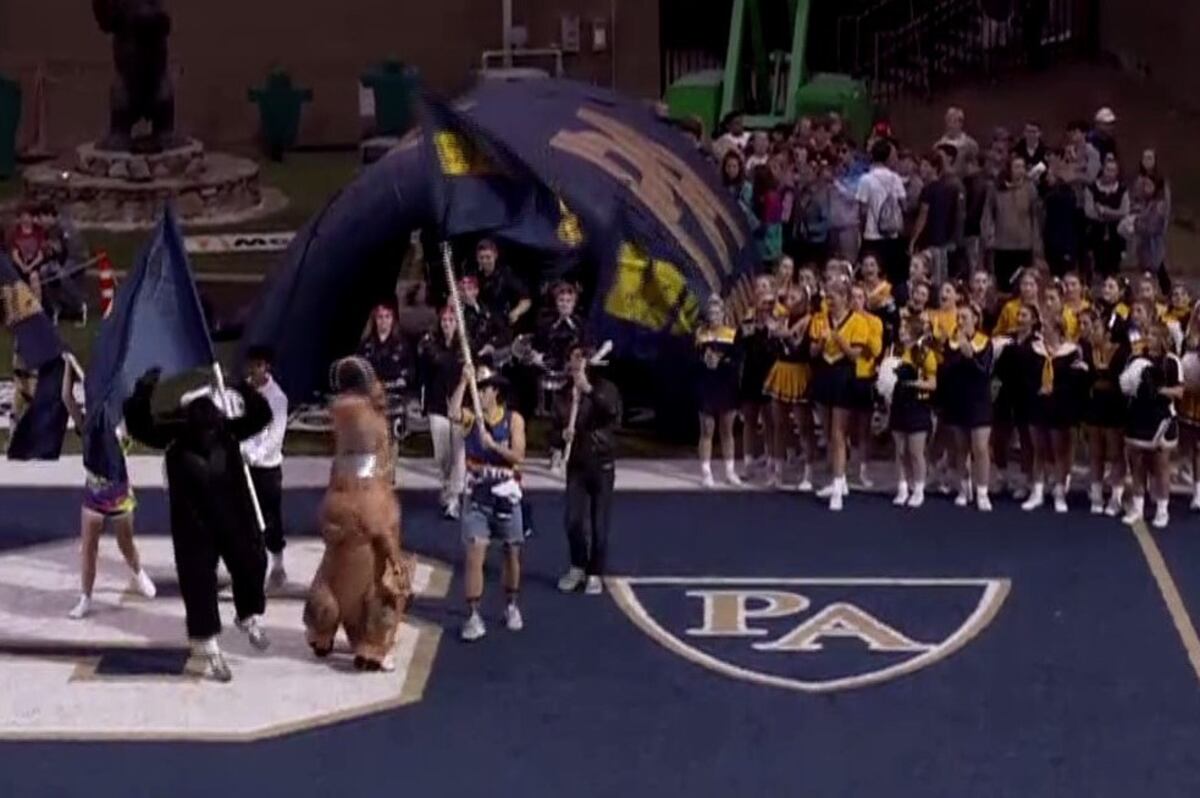 Pulaski Academy Enters Field Led by Harambe and T-Rex Mascots | News ...