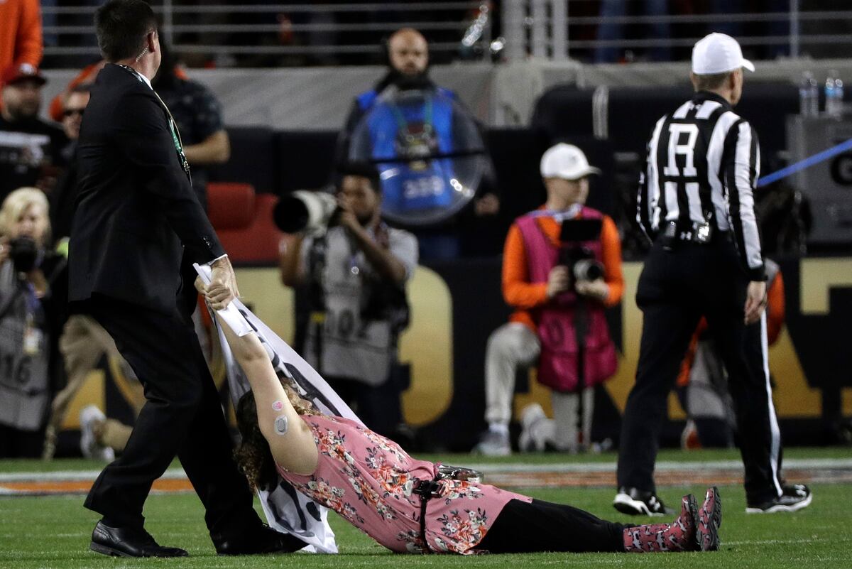 Alabama vs. Clemson: Watch Fan Get Carried off by Police After Storming ...