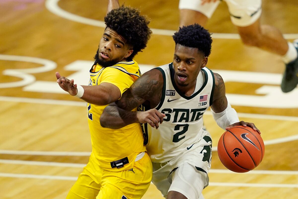 No. 2 Michigan Upset by Unranked Michigan State as Rocket Watts Scores ...